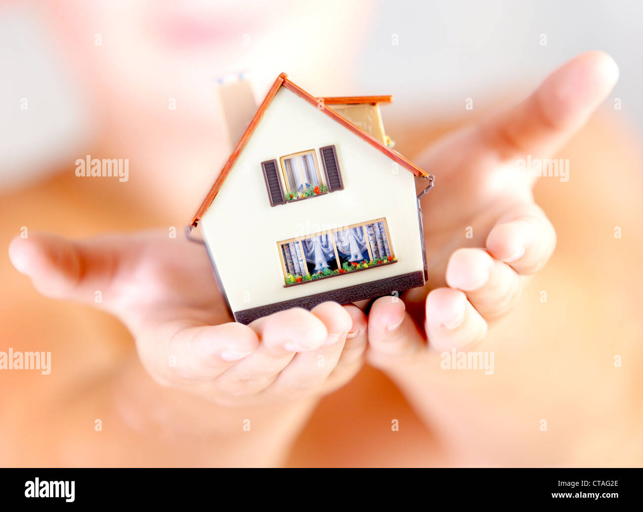 The house in human hands Stock Photo - Alamy