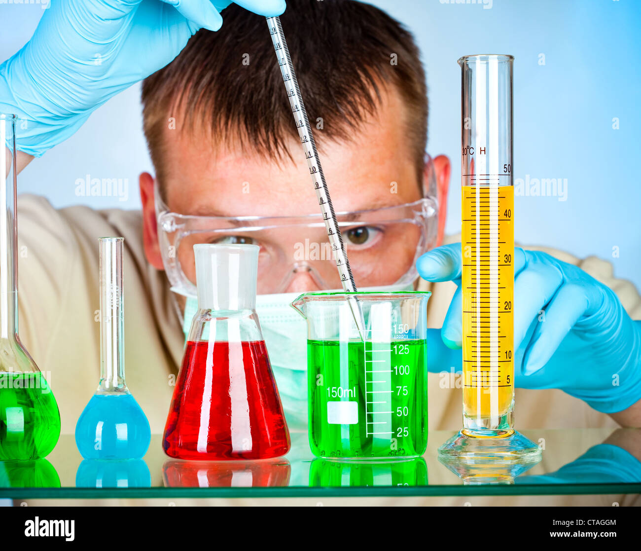 scientist in laboratory with test tubes Stock Photo - Alamy