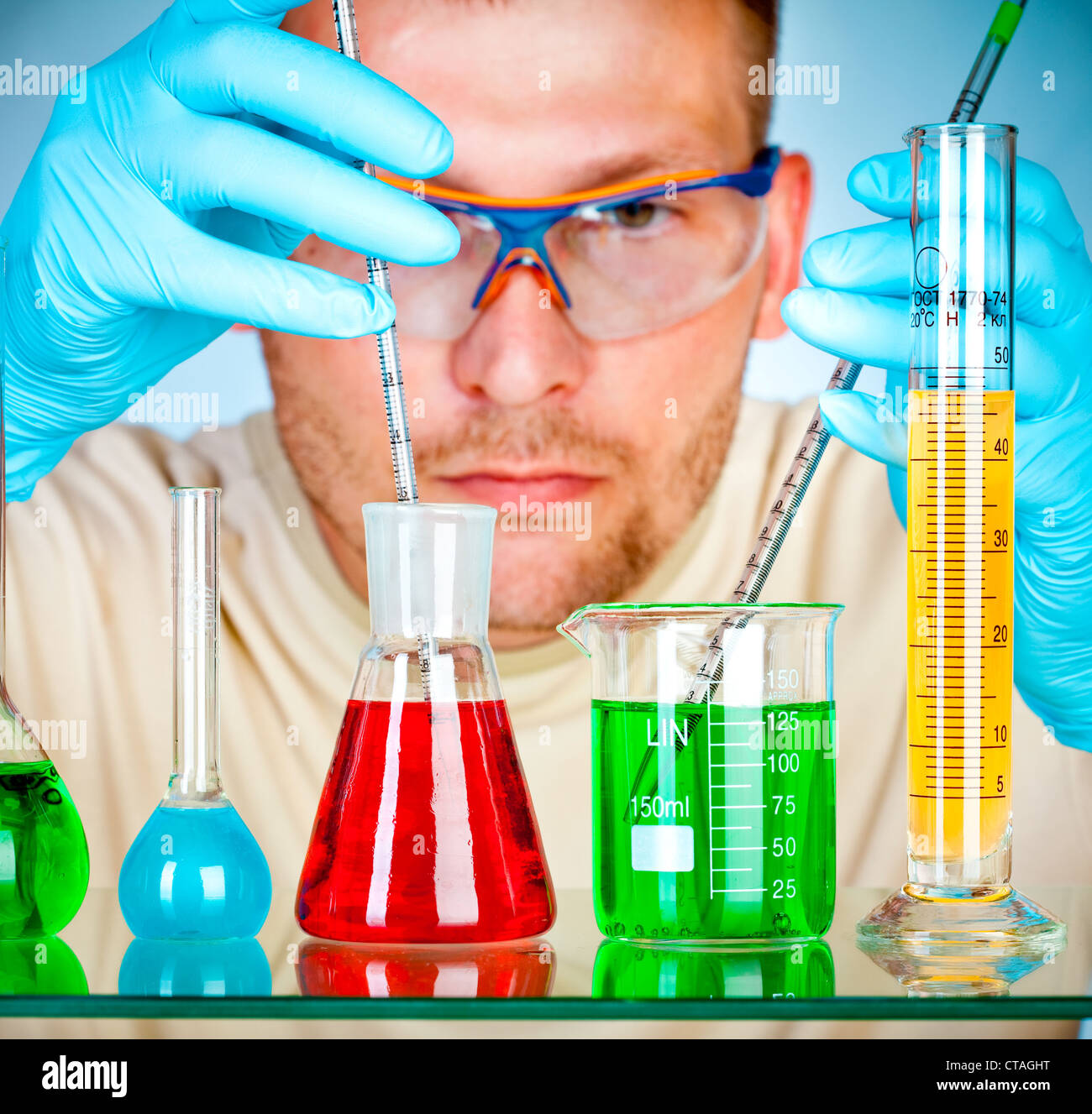 scientist in laboratory with test tubes Stock Photo - Alamy