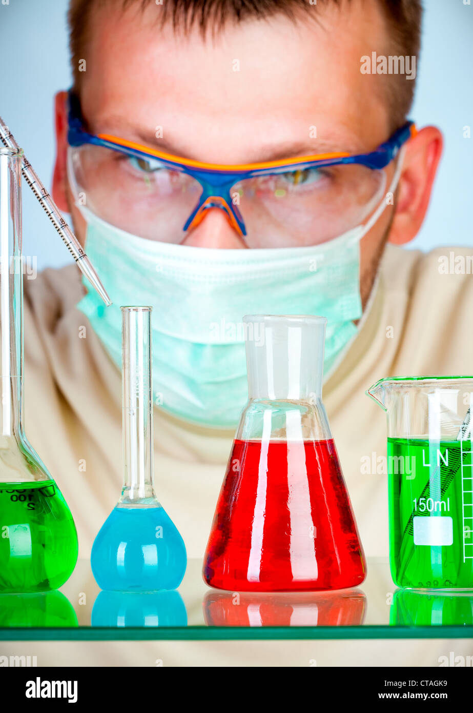 scientist in laboratory with test tubes Stock Photo - Alamy