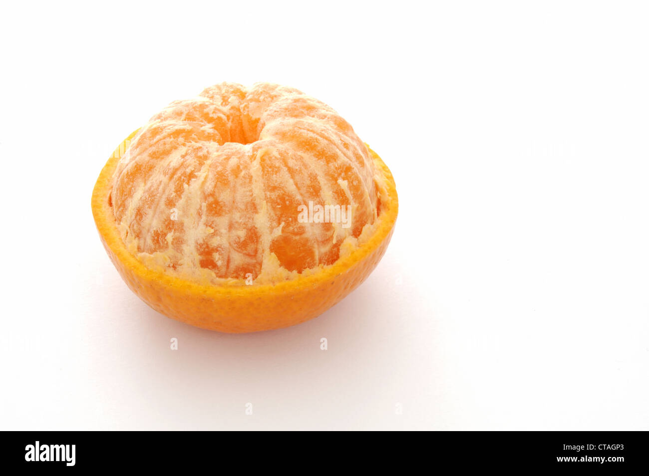 Half-peeled mandarin orange isolated on a white background Stock Photo ...