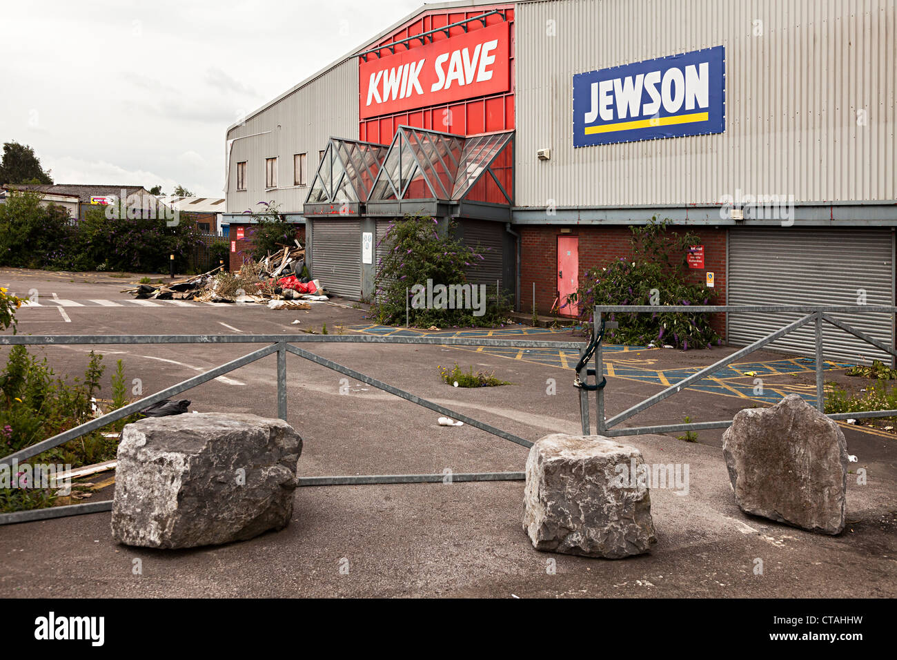 Closed down store with rocks placed as barrier to car park, Cardiff ...