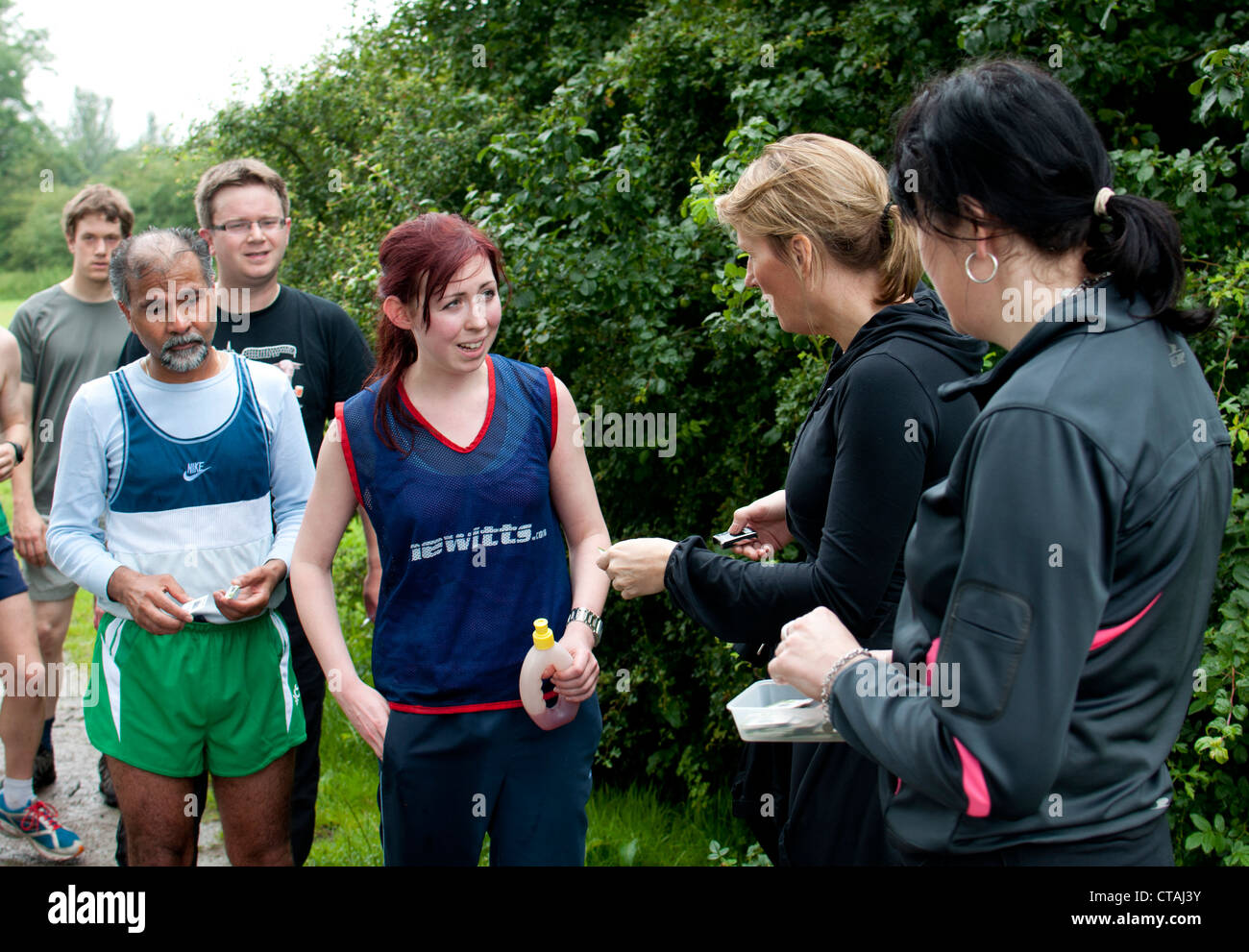Scanning bar codes of runners at Arrow Valley parkrun Stock Photo - Alamy