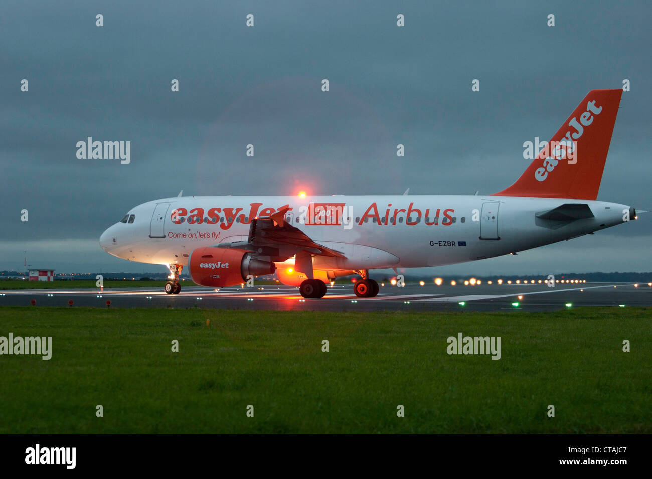 EasyJet A319-111 G-EZBR taxi's onto runway 27 on an early departure ...