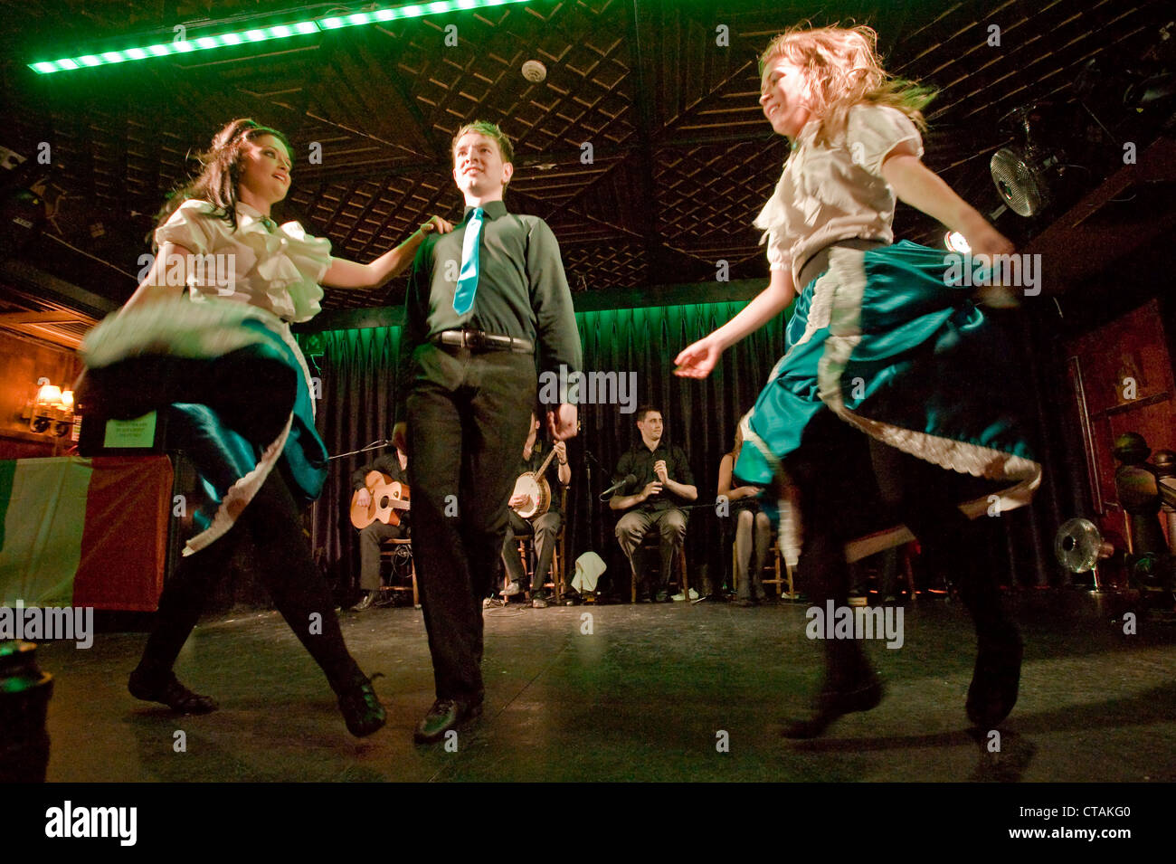 Members of the "Celtic Rhythm Professional Irish Dancers" on stage with ...