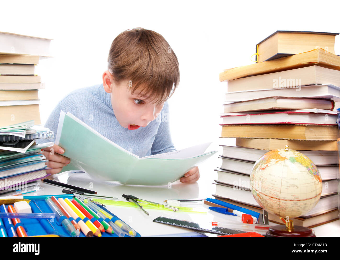 Boy behind table books hi-res stock photography and images - Alamy