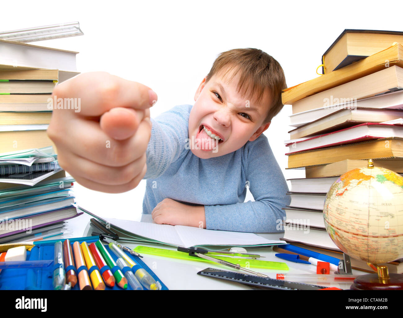 The boy behind a table with books Stock Photo - Alamy