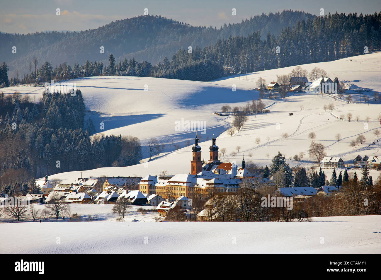 St Peters abbey and the village of St Peter on a winters day, Black ...