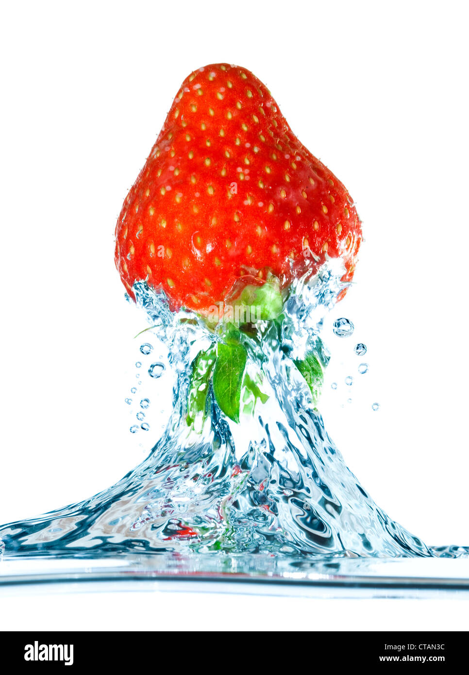 Strawberry and water on a white background Stock Photo - Alamy