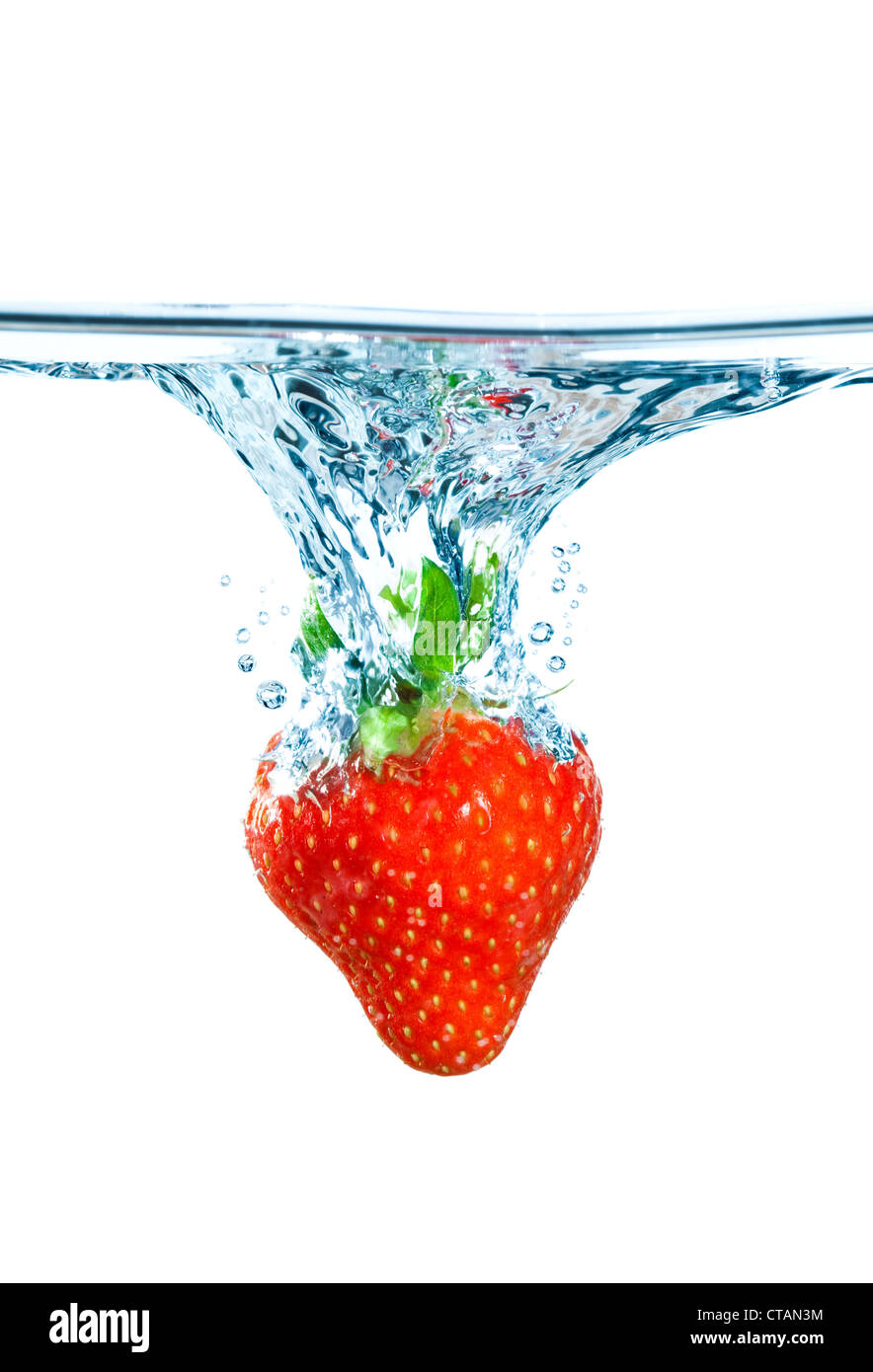 Strawberry and water on a white background Stock Photo - Alamy