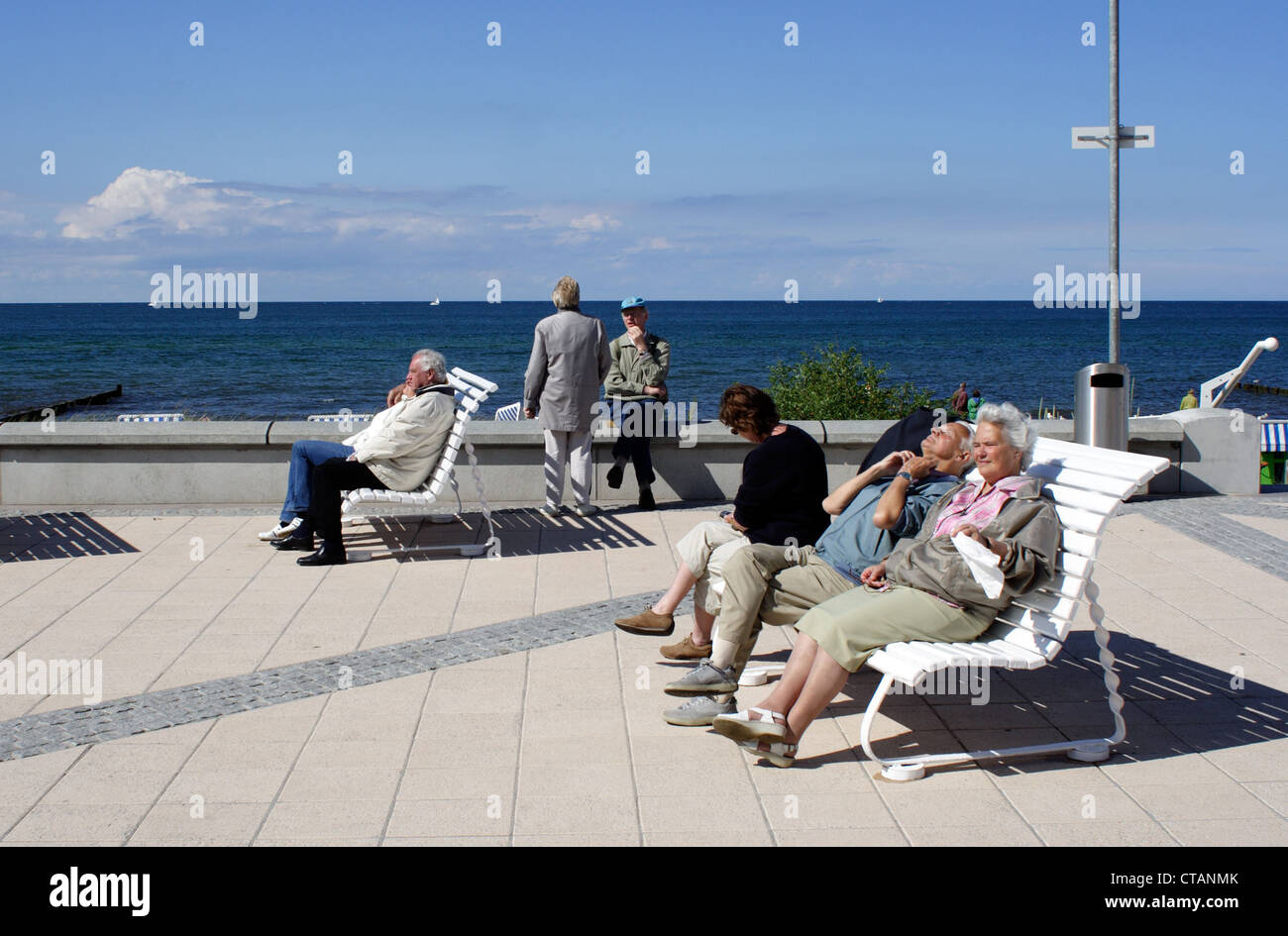 Kuehlungsborn, seniors sunbathing on the beach promenade Stock Photo ...
