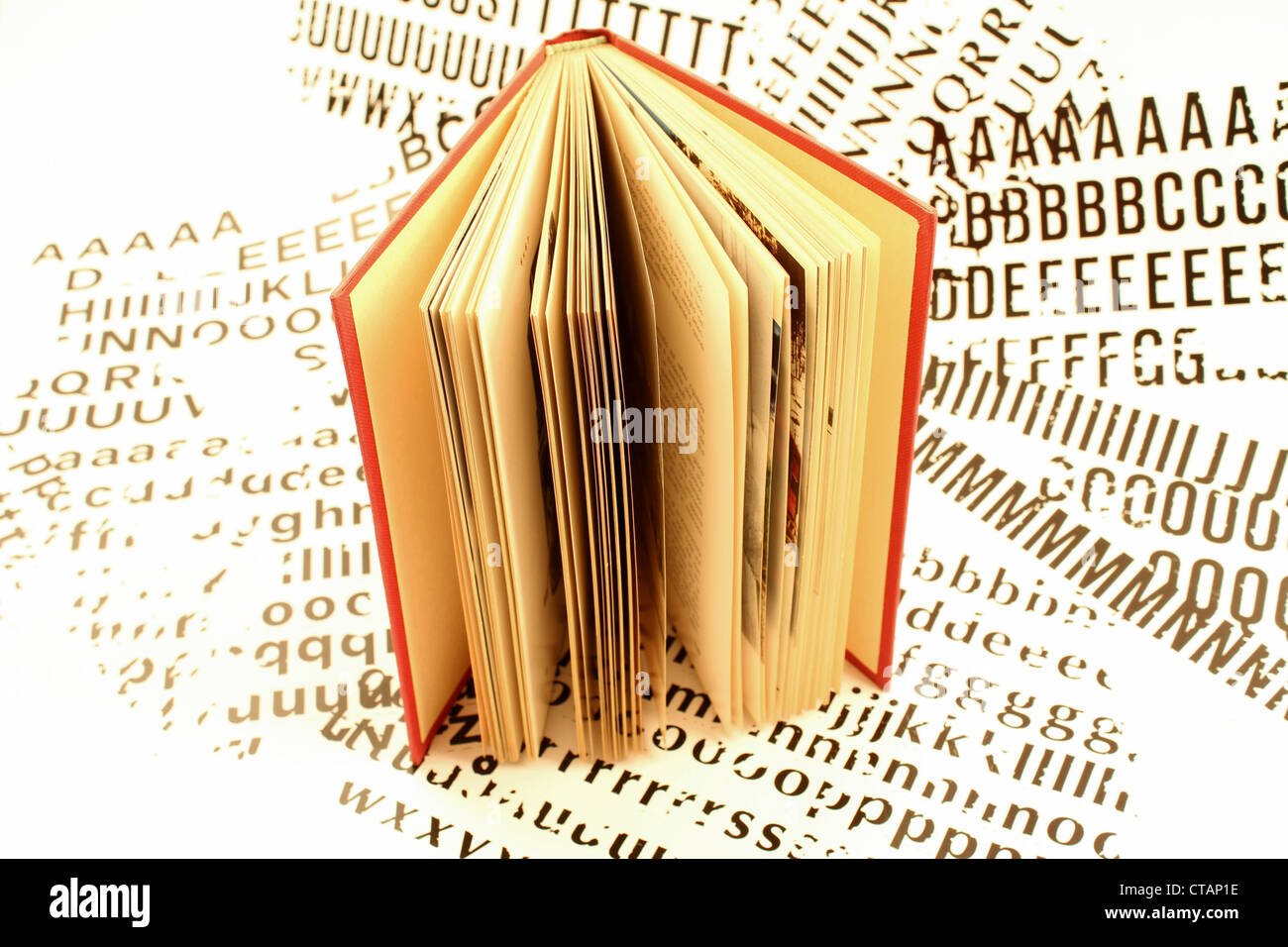 Antique books open vertically - background with printed letters Stock ...