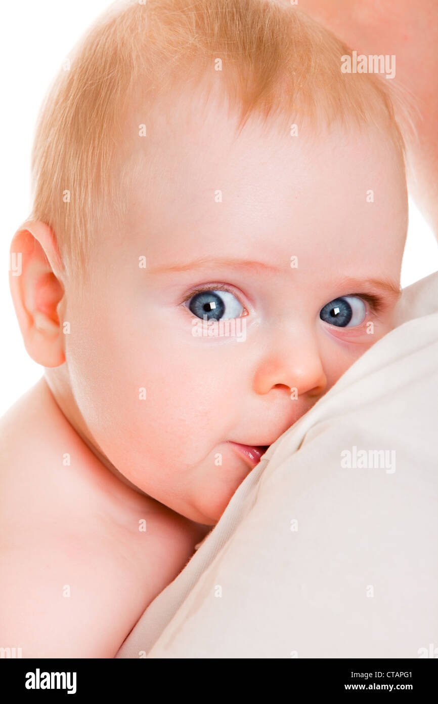 baby on a shoulder at mum on a white background Stock Photo - Alamy