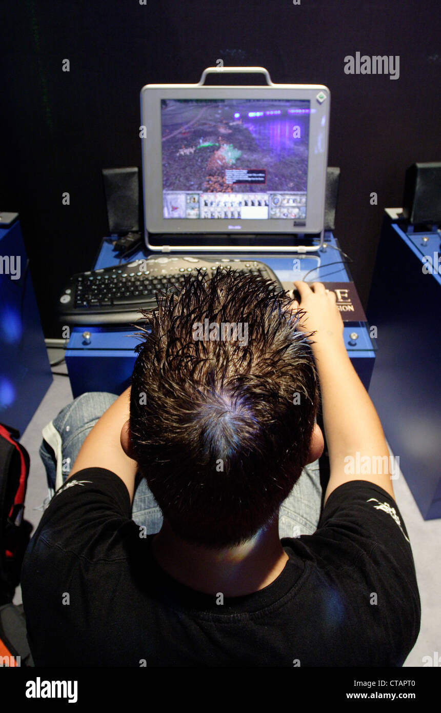 Leipzig Games Convention 2005, young people playing a game of strategy ...