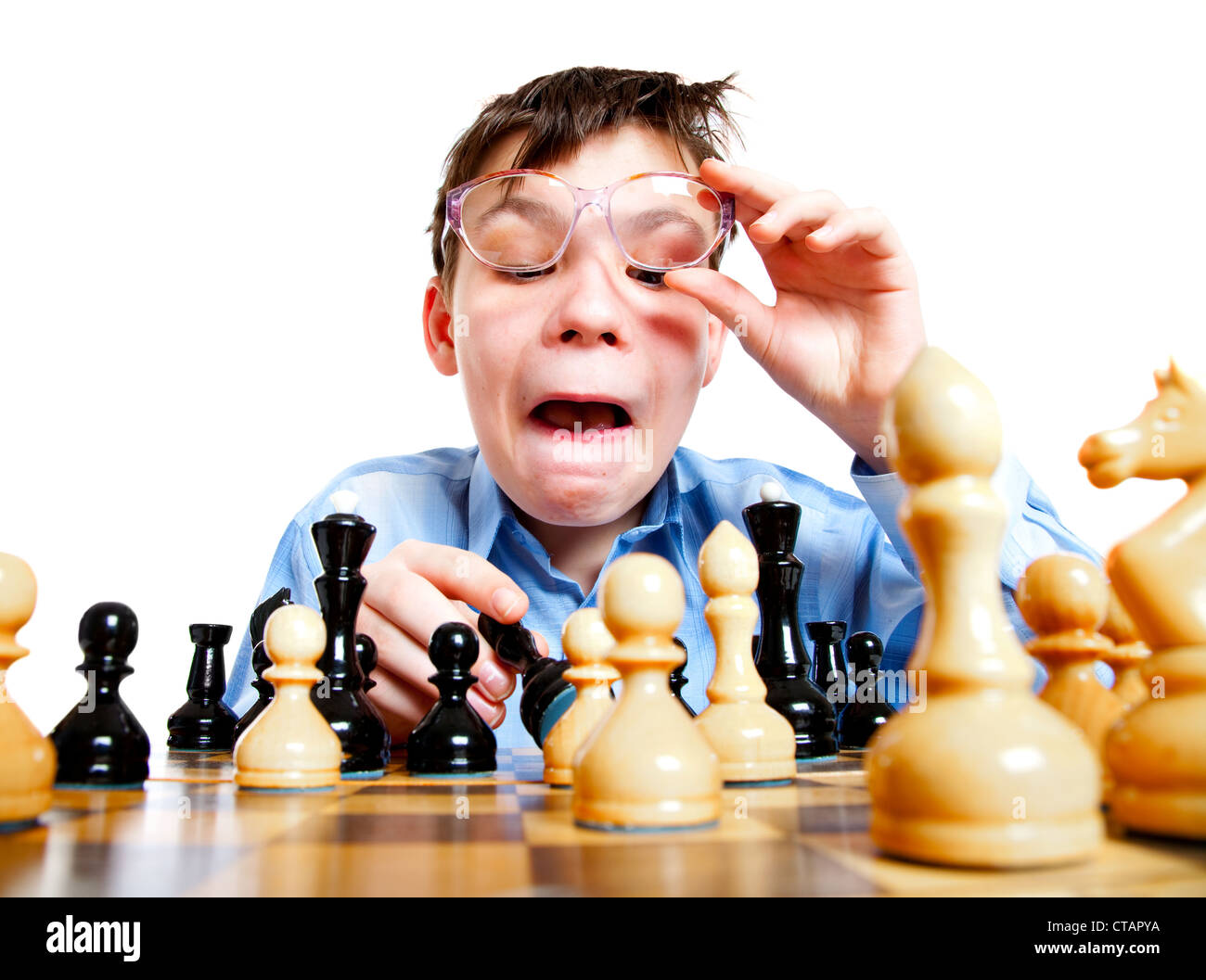 Nerd play chess on a white background Stock Photo - Alamy