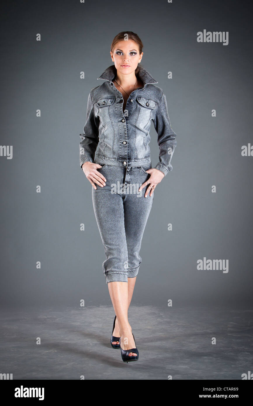 girl in jeans collection clothes on a dark background Stock Photo - Alamy