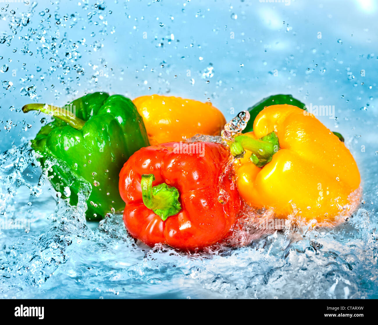 fresh water splash on peppers Stock Photo - Alamy