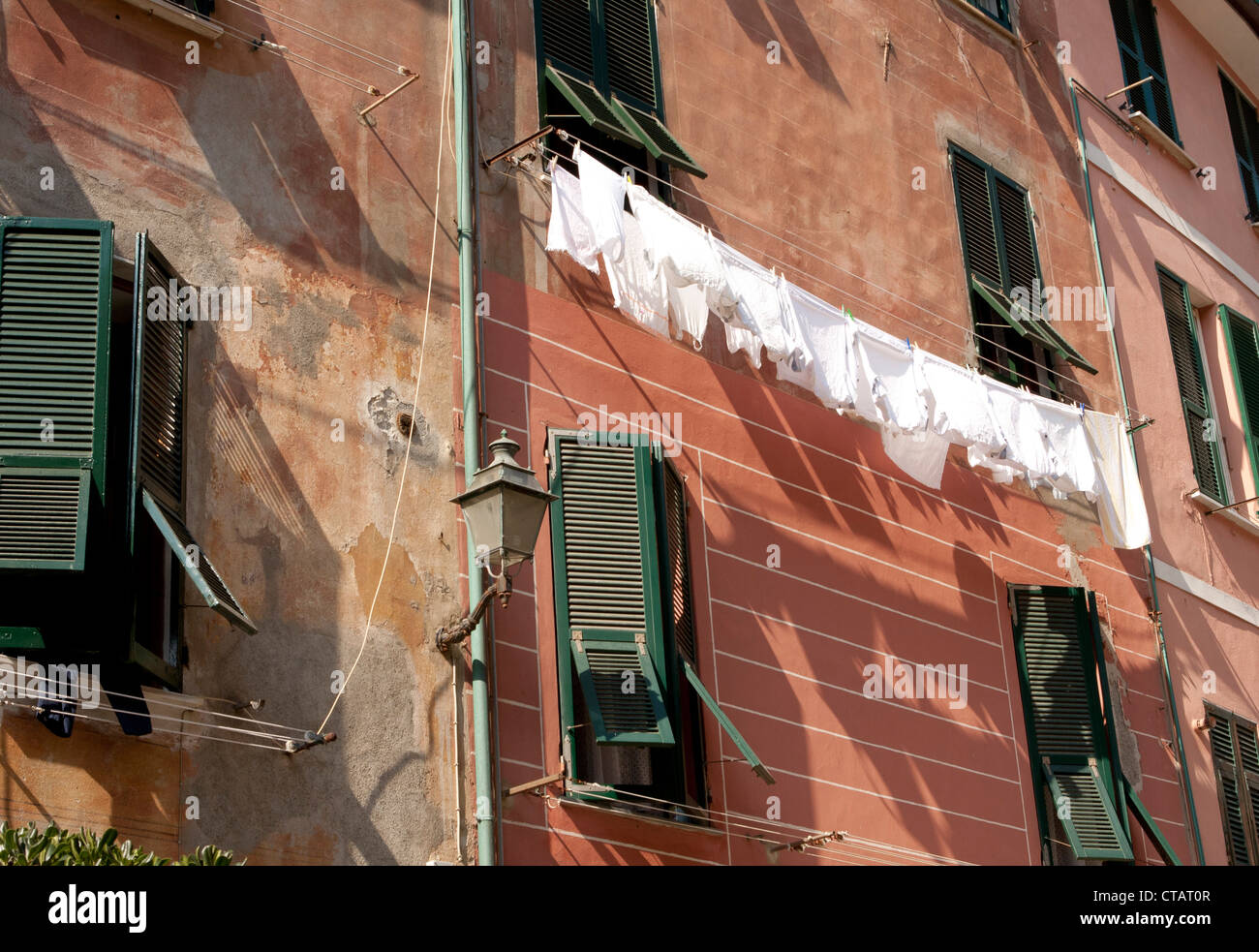 Laundry Drying on a window clothesline in Italy Stock Photo - Alamy