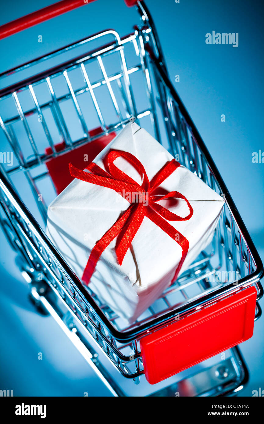 Empty shopping cart on the blue Stock Photo - Alamy