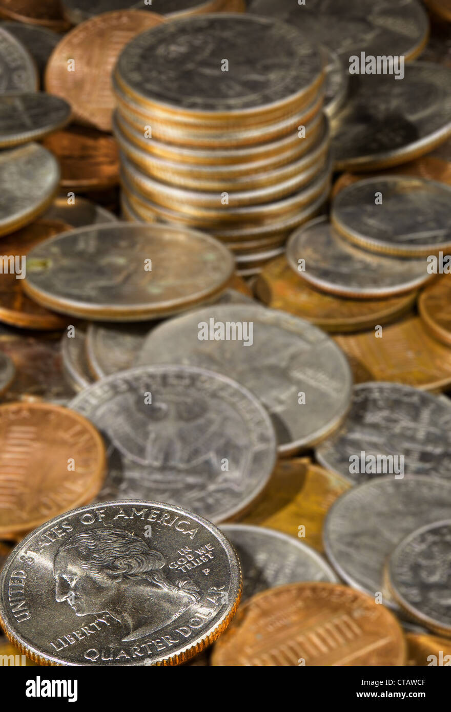 Macro image withy focus on quarter in a pile of USA currency coins in ...