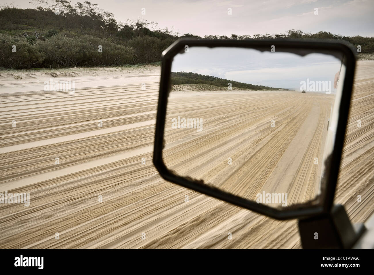 Offroad vehicle in mirror while driving at sand island, Fraser Island ...