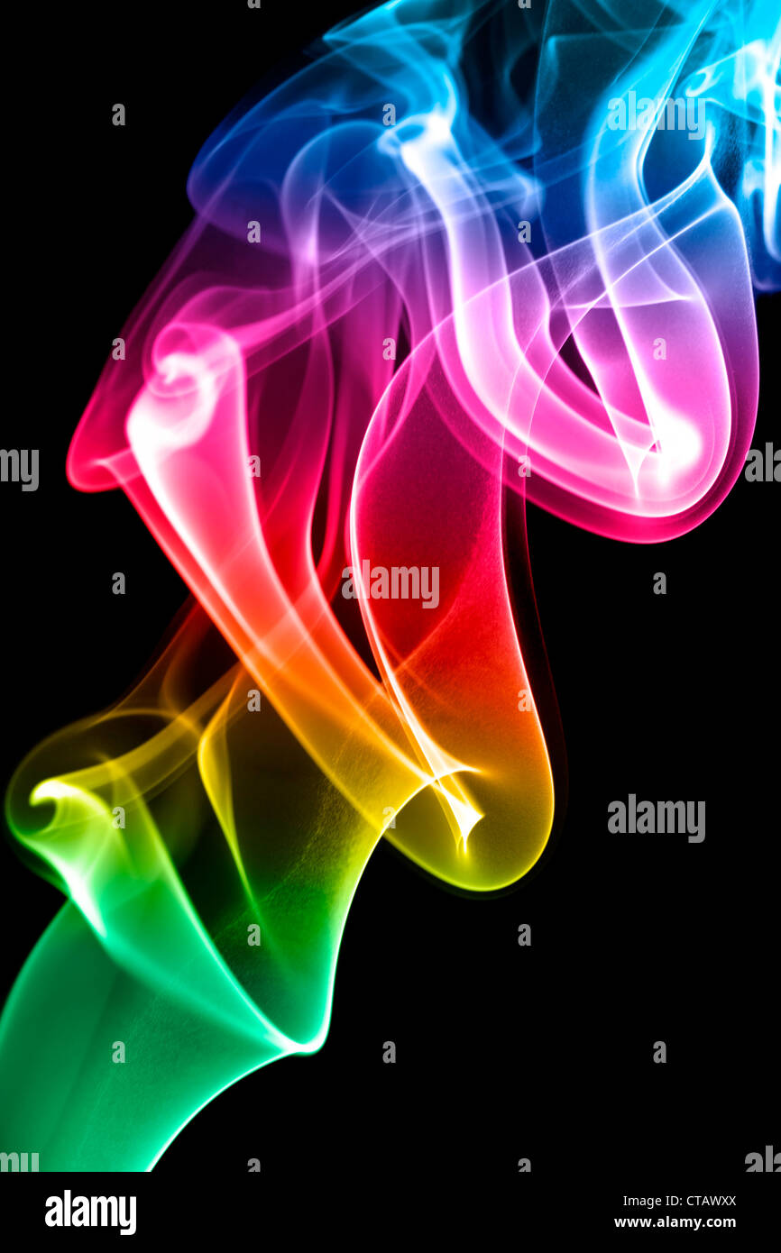 Multi-coloured smoke on a black background Stock Photo - Alamy