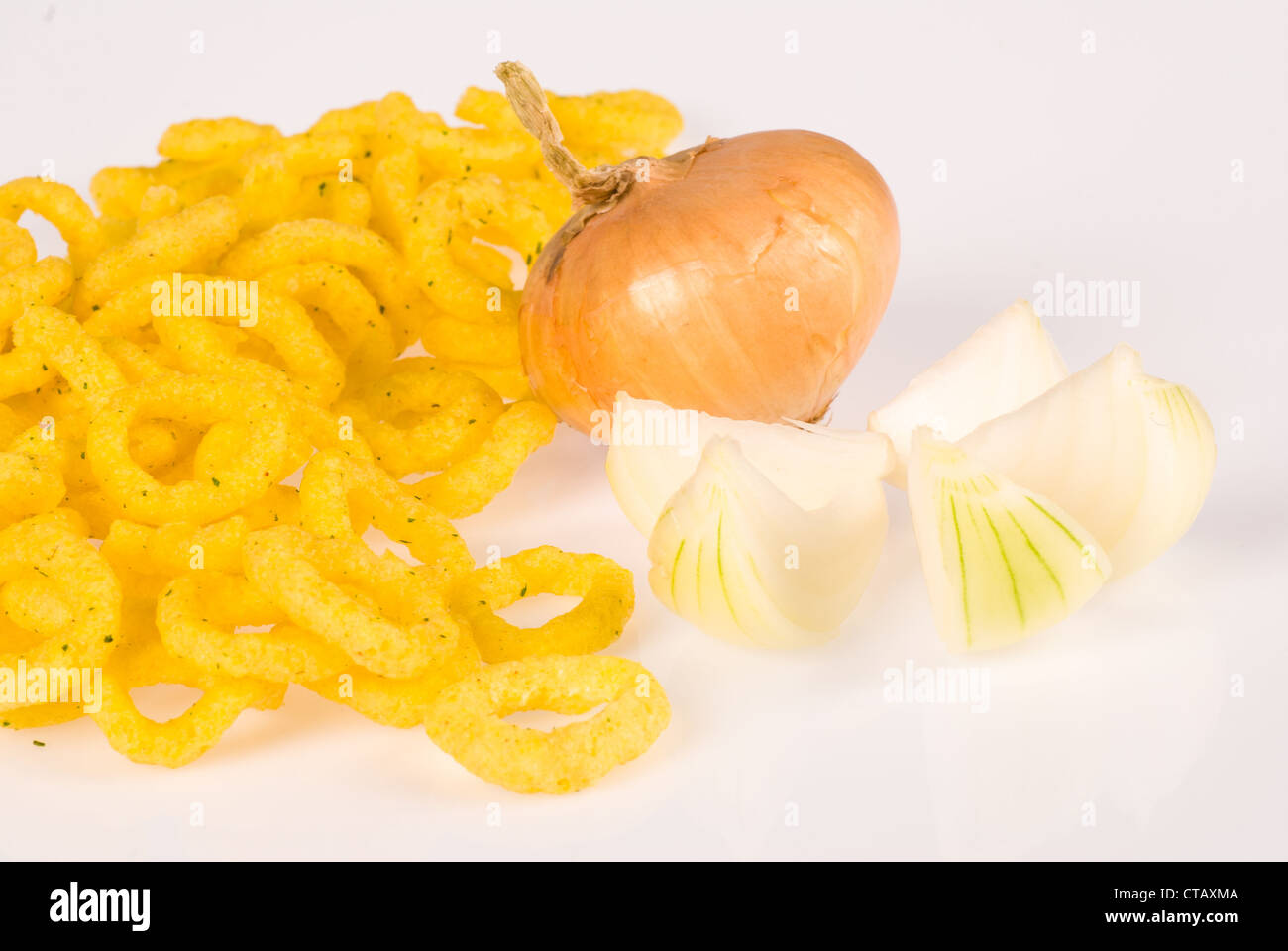 Crunchy onion flavored maize snacks and their ingredient Stock Photo ...
