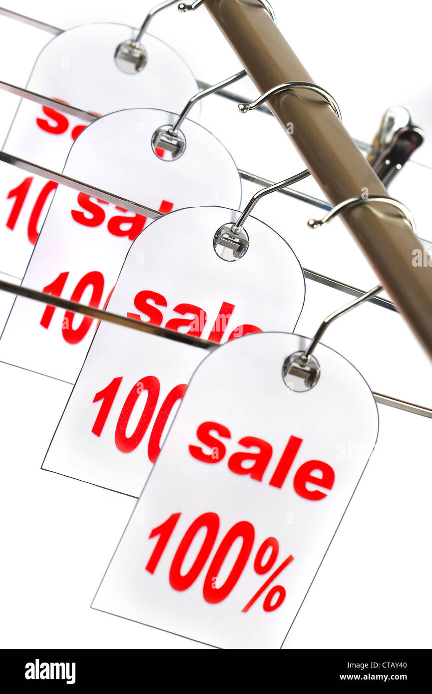 Sale. A hanger with labels on a white background Stock Photo - Alamy
