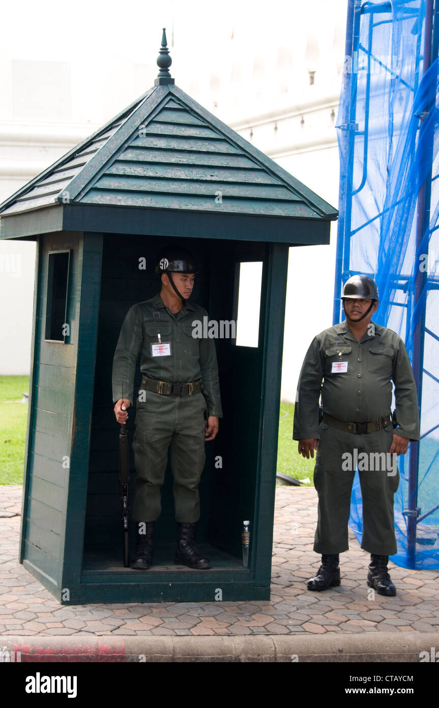 A sentry of the Thai Army stands guard in his box at the gates of the ...
