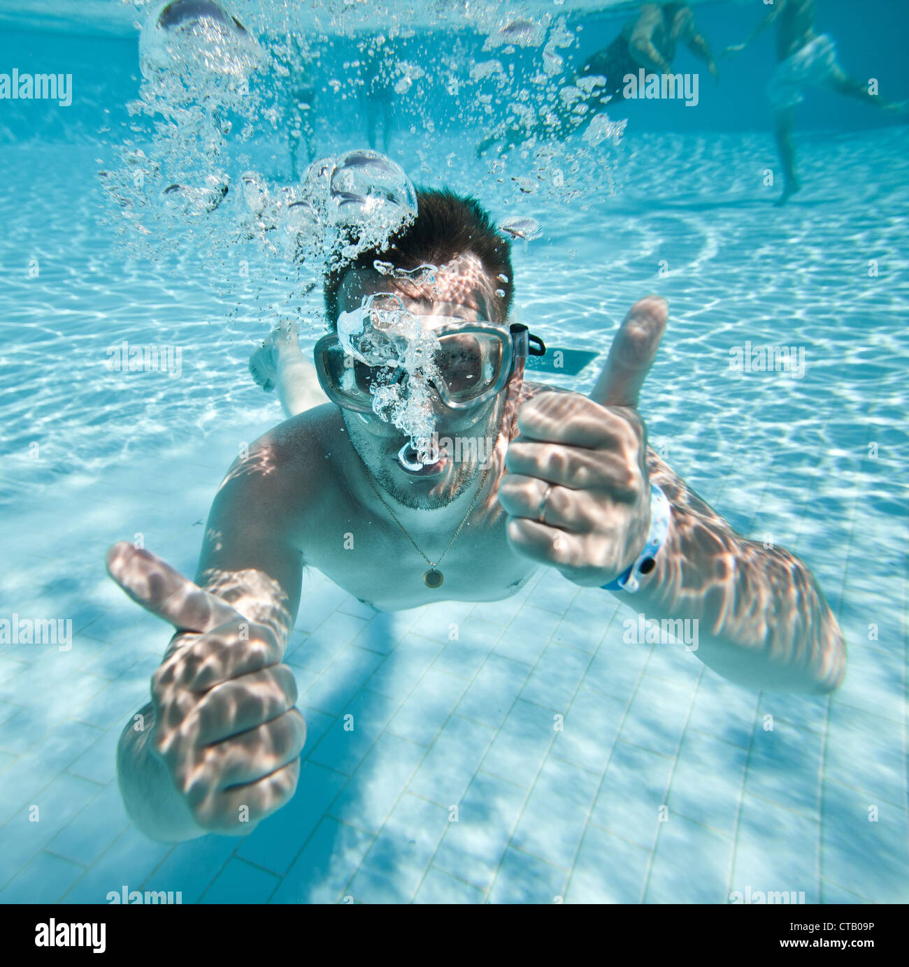 man floats underwater in pool Stock Photo - Alamy
