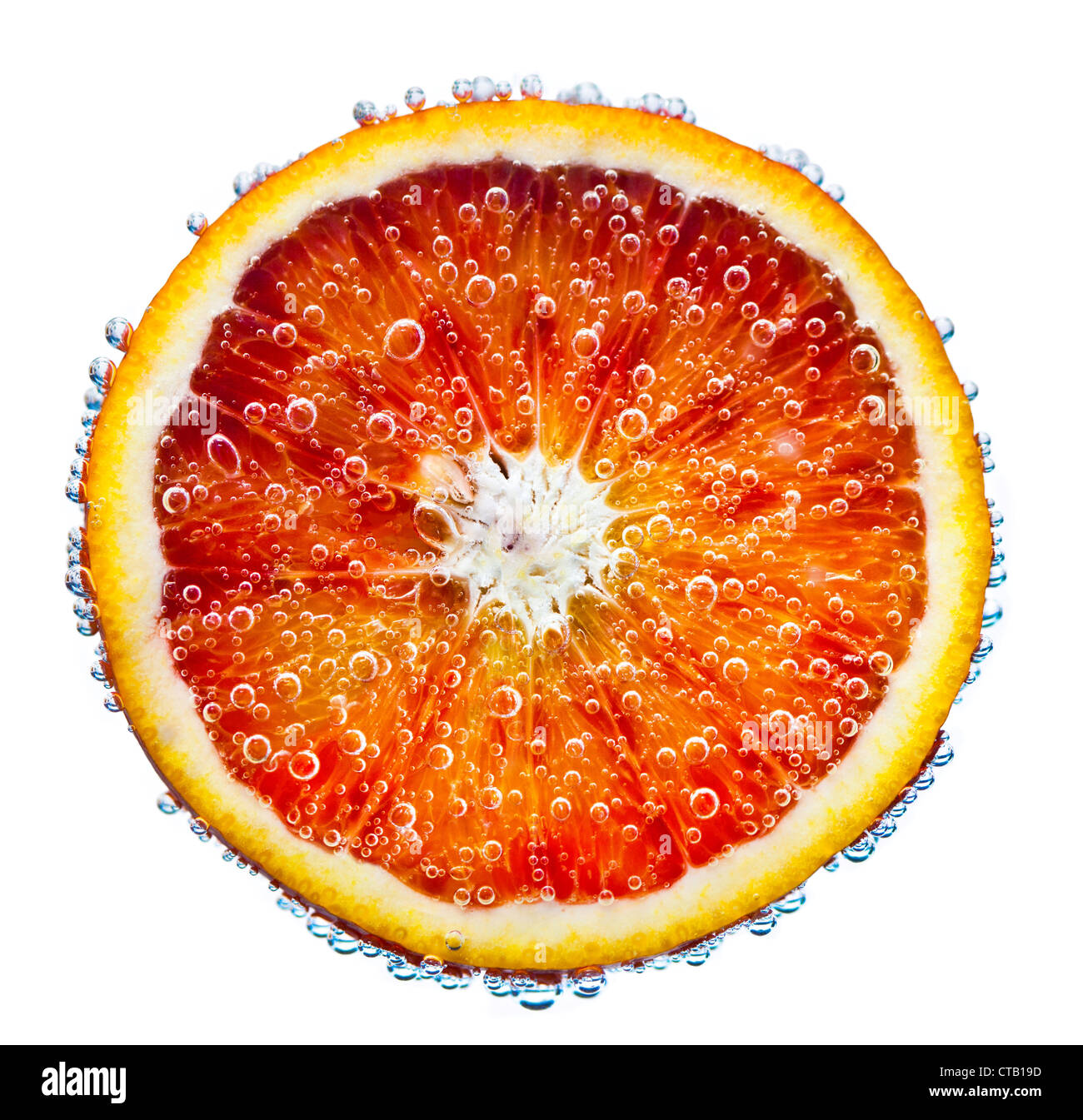 fresh red orange falls in water on a white background Stock Photo - Alamy