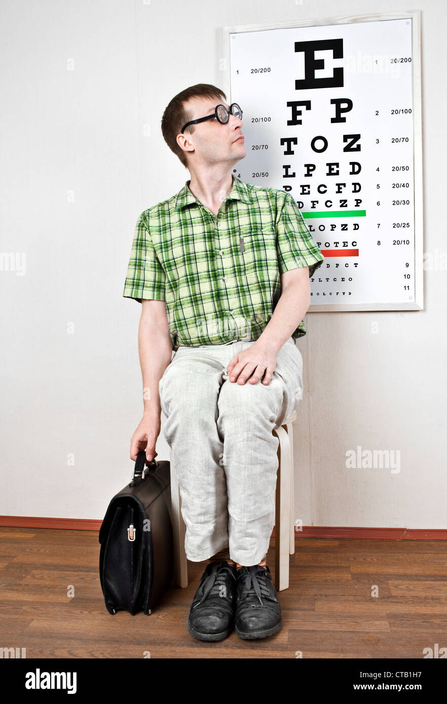 person wearing spectacles in an office at the doctor Stock Photo - Alamy