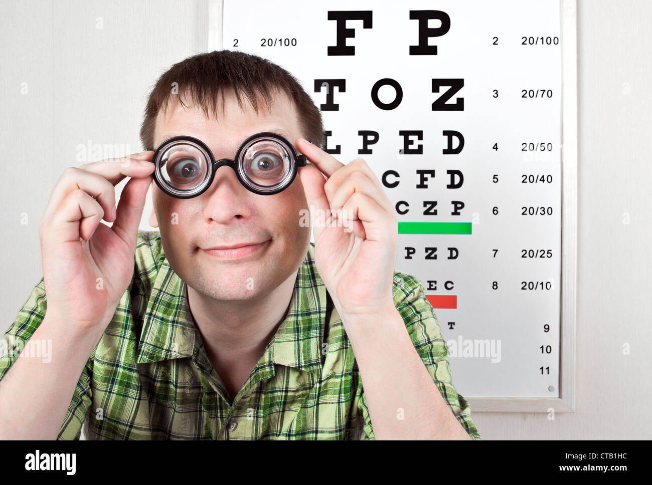 person wearing spectacles in an office at the doctor Stock Photo - Alamy