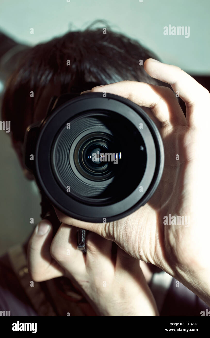 Men's hands held camera closeup Stock Photo - Alamy