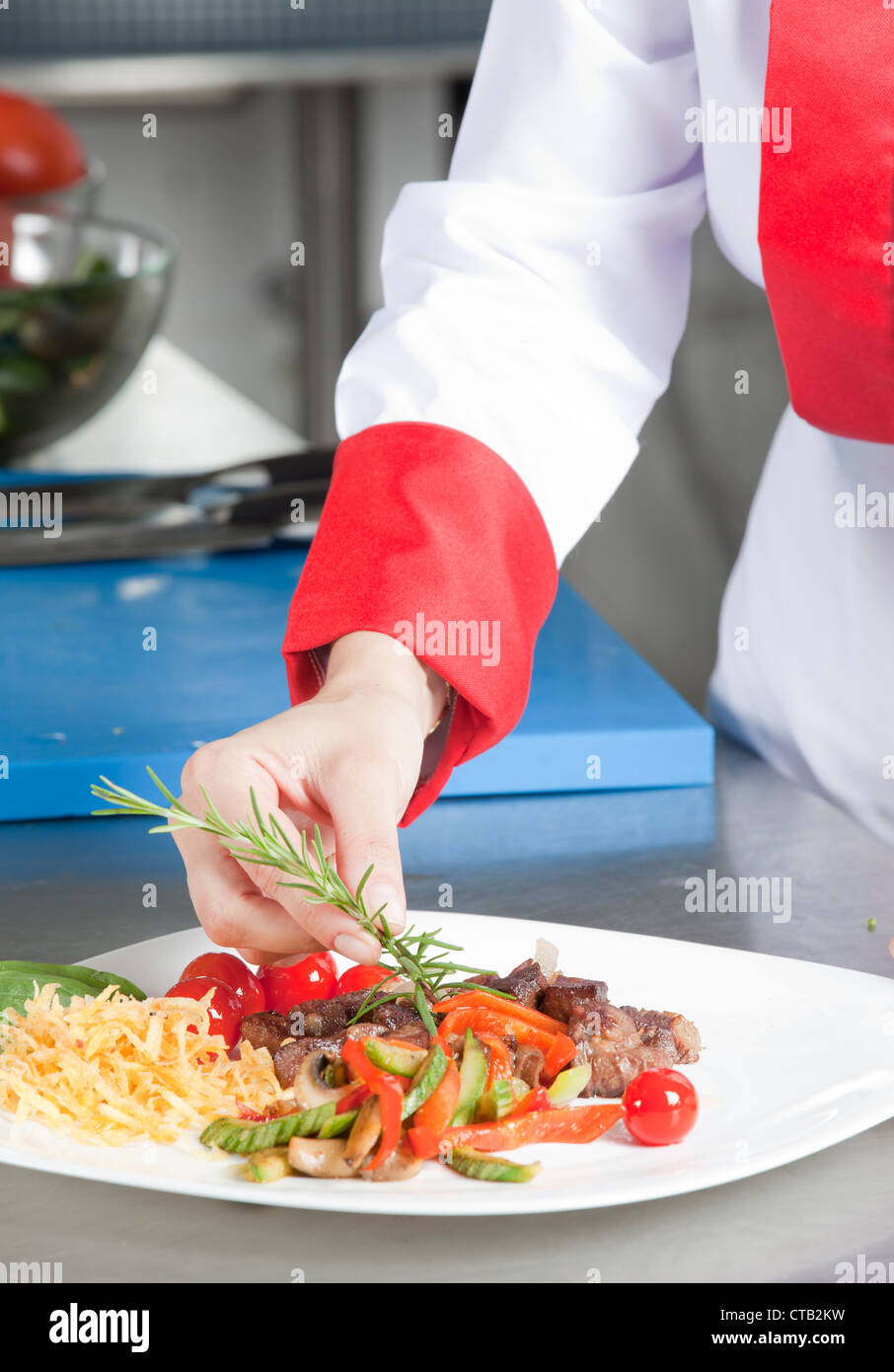 beautiful young chef decorating Stock Photo - Alamy