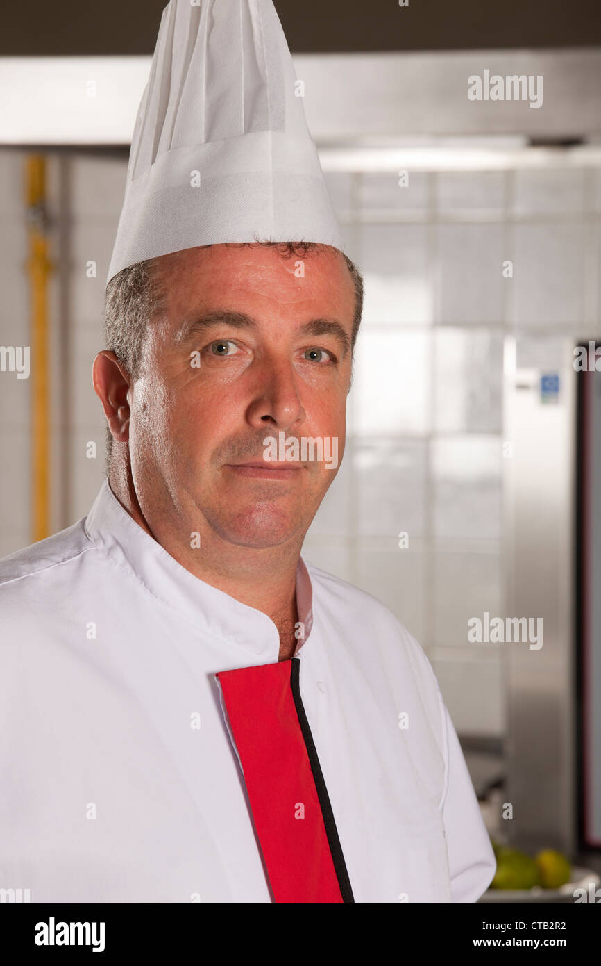 Portrait of smart chef preparing delicious meal for customer Stock ...