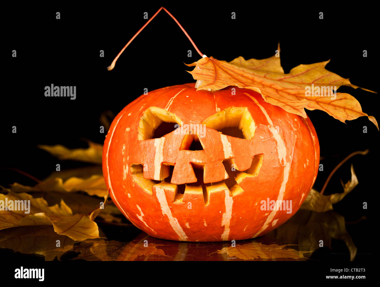 Scary old jack-o-lantern on black background Stock Photo - Alamy