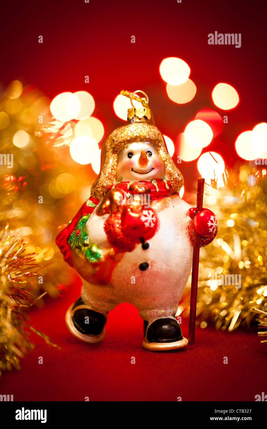 Snowman on the red background Stock Photo - Alamy