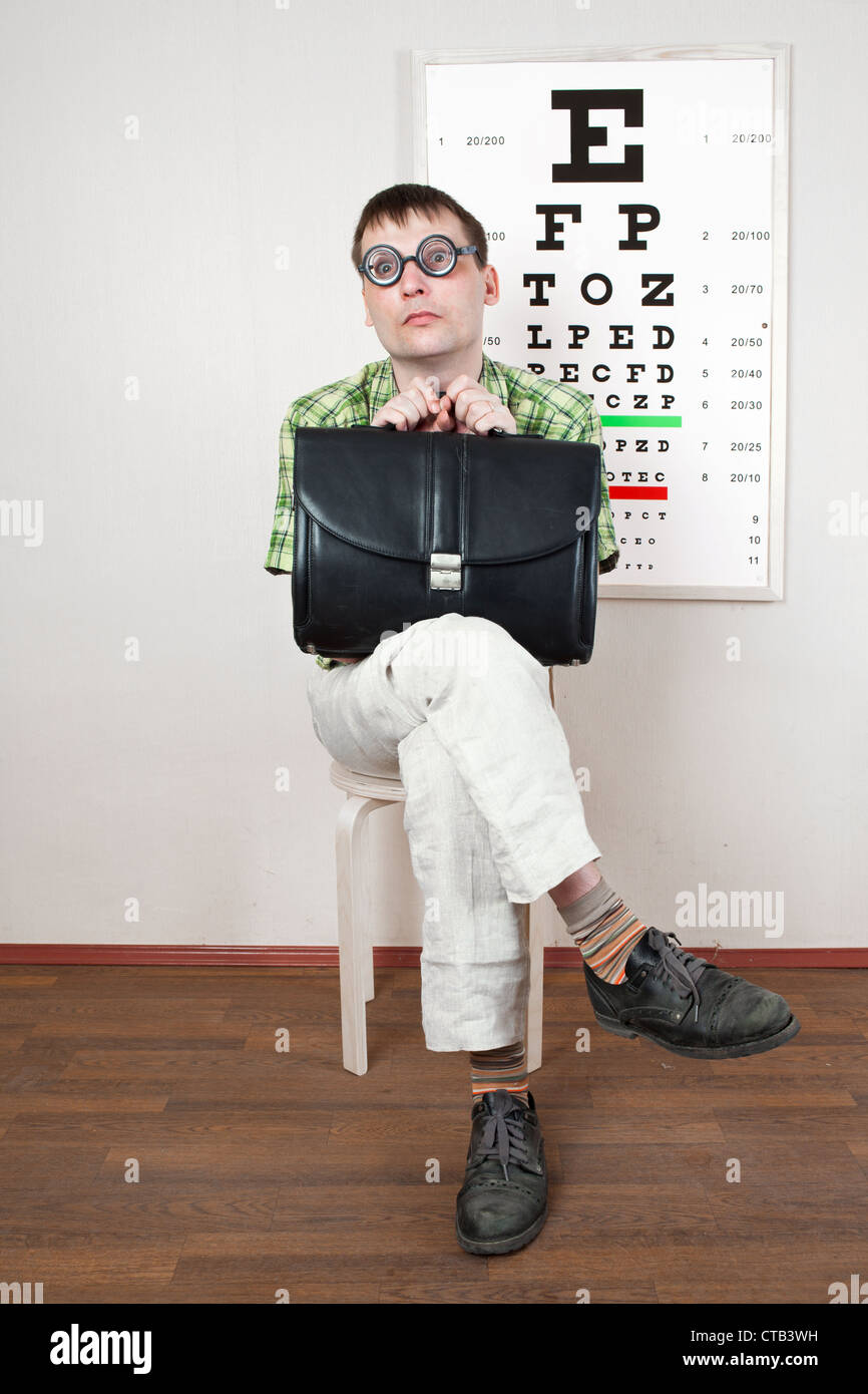 person wearing spectacles in an office at the doctor Stock Photo - Alamy