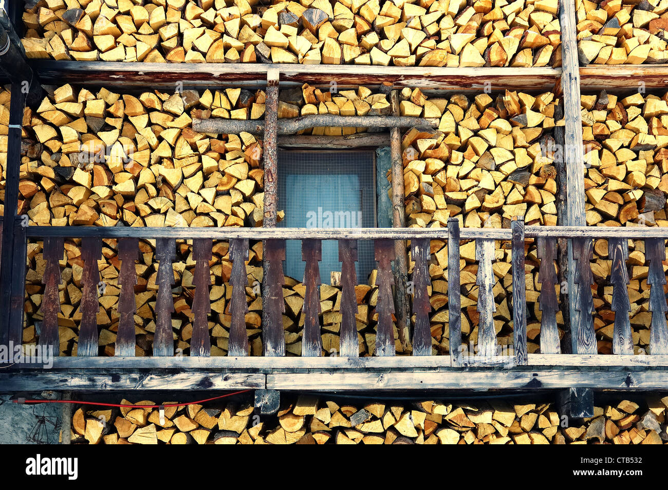 Stack of wood outside an old mountain house Stock Photo - Alamy