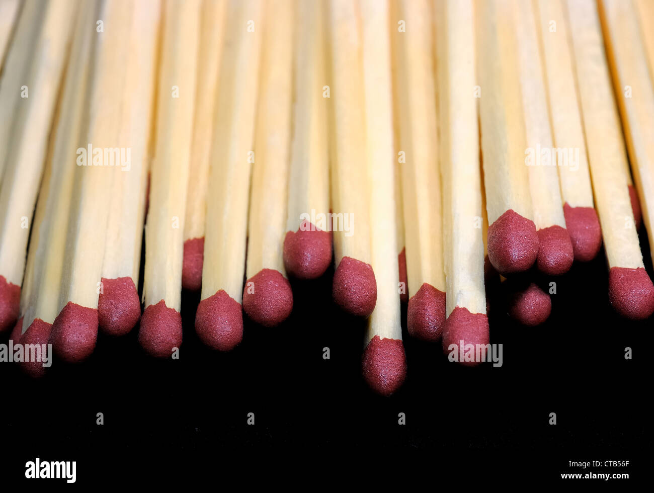 Close-up of group of matches, black background Stock Photo - Alamy