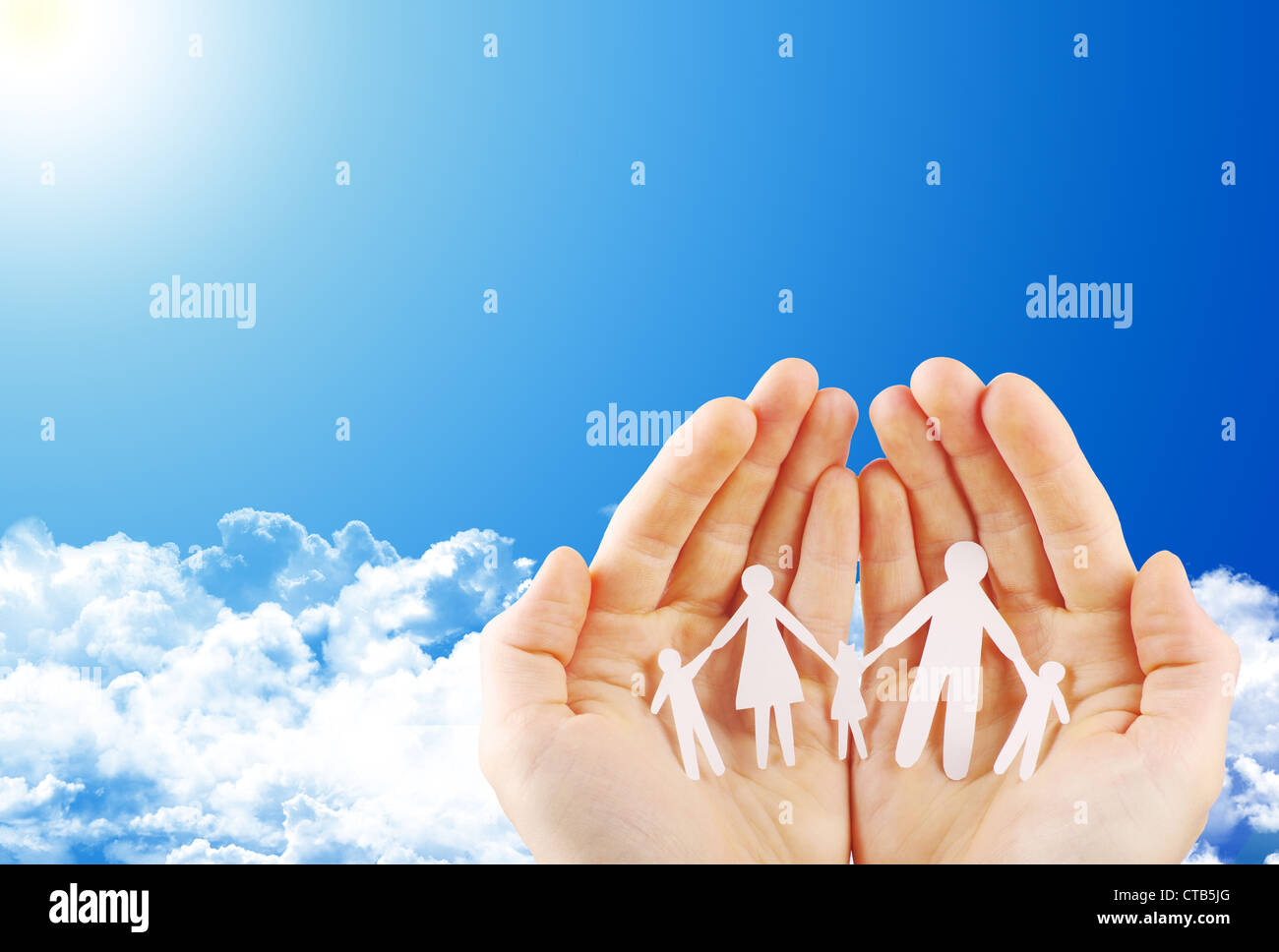 Paper family in hands isolated on white background Stock Photo - Alamy