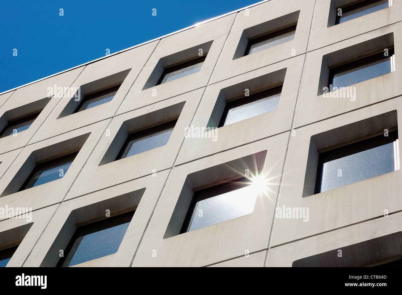Modern building windows reflecting the light of sun Stock Photo - Alamy
