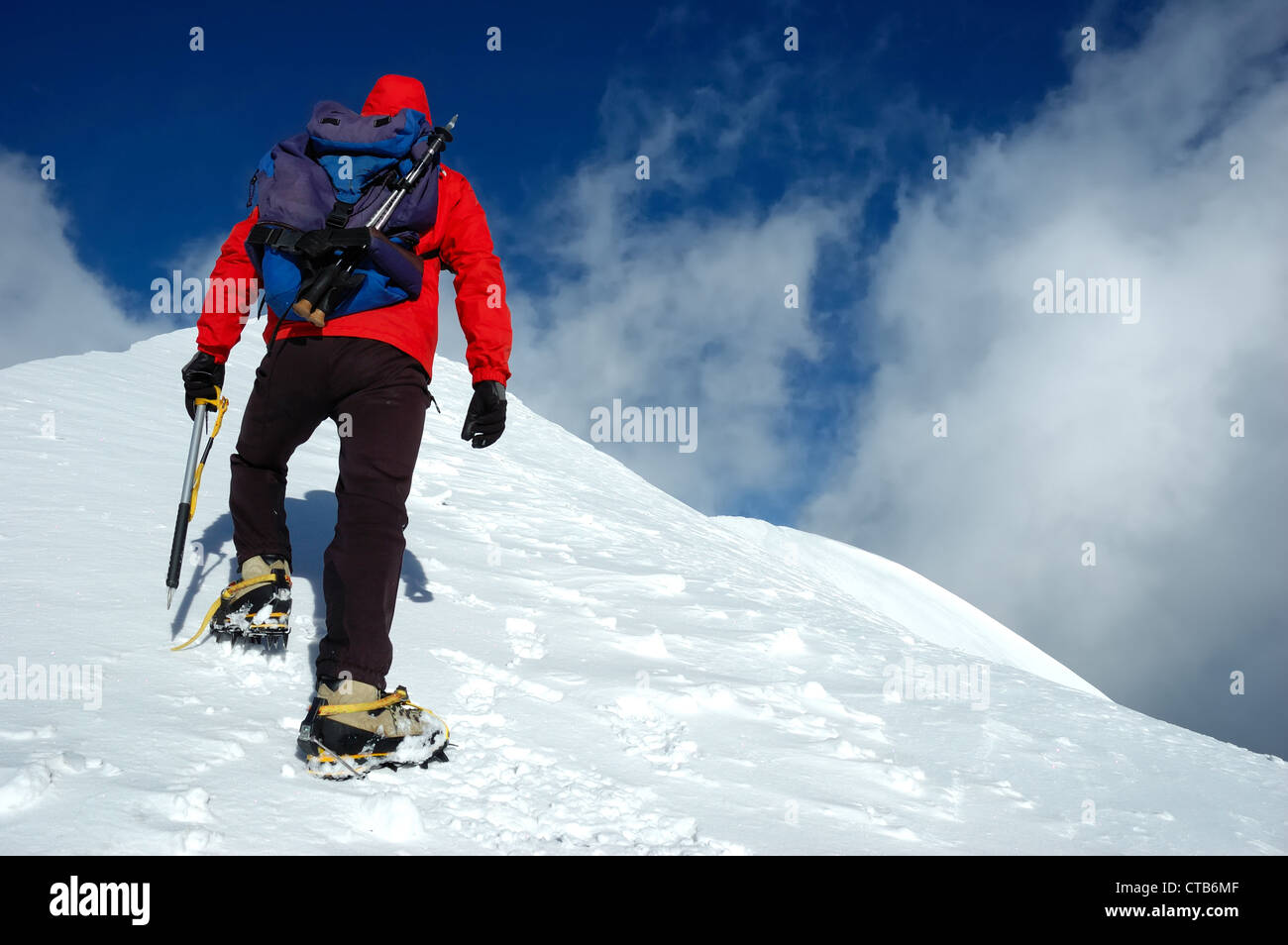 Mountain climber reaching summit hi-res stock photography and images ...