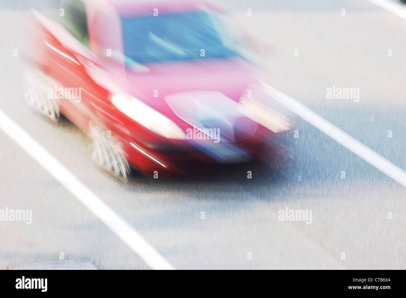 Fast moving red car with blurred effect Stock Photo - Alamy