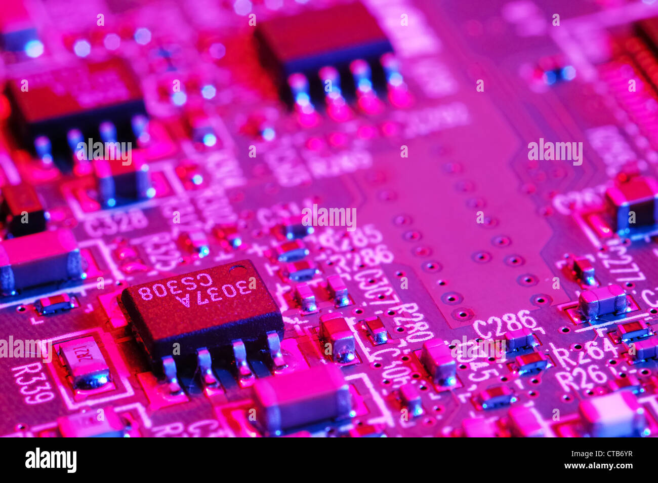 Close-up photo of computer circuit board; blue red tone Stock Photo - Alamy