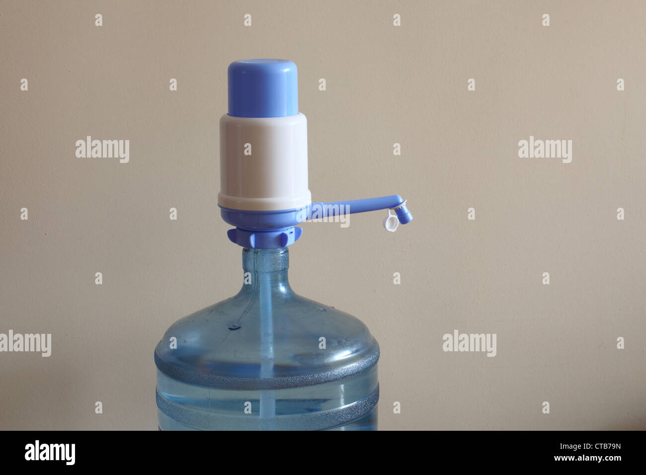 large bottle of water on a beige background in home Stock Photo - Alamy