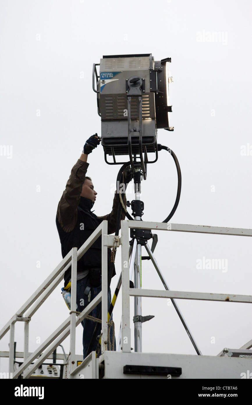 Media professional, lighting with headlights Stock Photo - Alamy