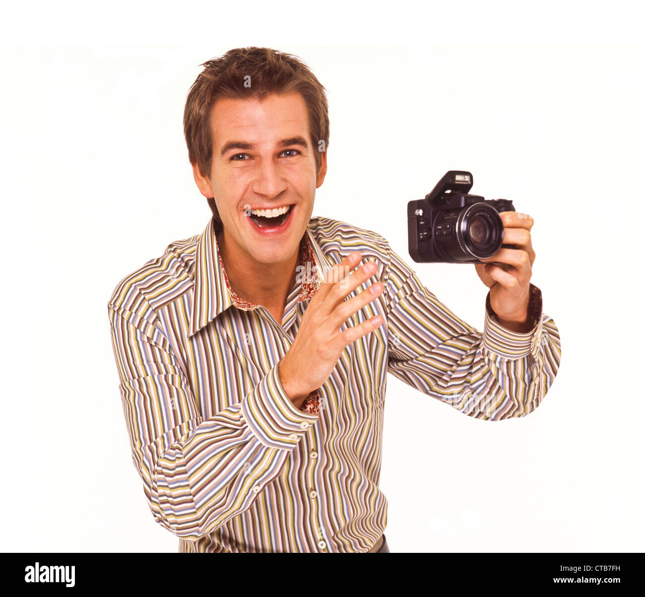 Young good looking white man with a digital camera, showing various ...