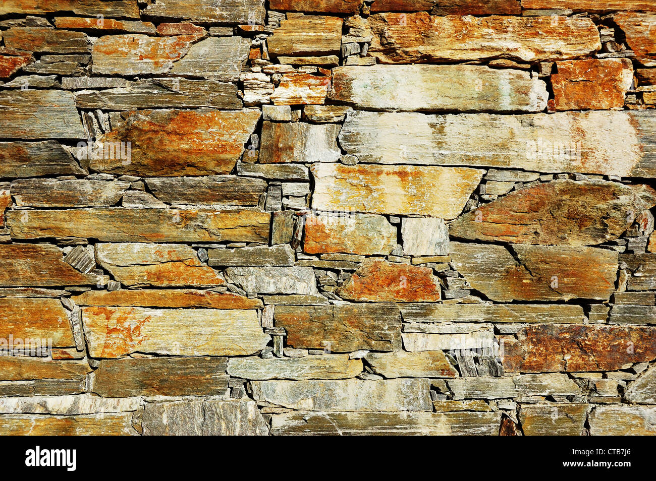 Detail of a colorful stone wall Stock Photo - Alamy